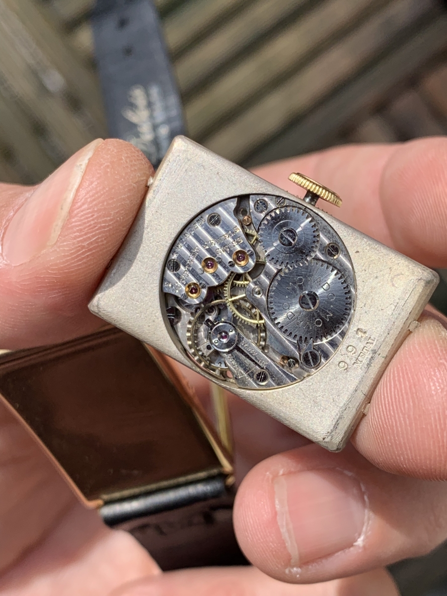 Movado Rectangular 18k gold wristwatch circa 1920's | Vintage Times