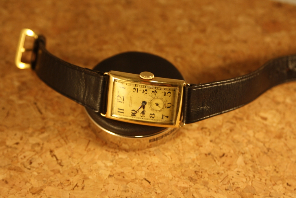 Movado Rectangular 18k gold wristwatch circa 1920's | Vintage Times