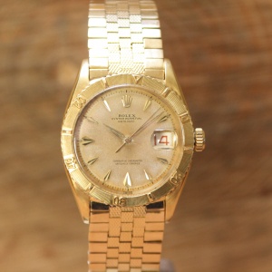 Rolex Thunderbird ref 6609 in yellow gold with a rare brick textured ...